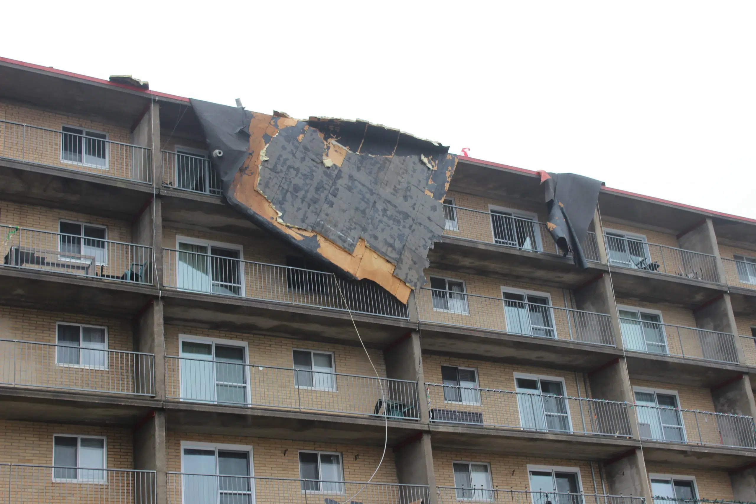 UPDATE: Two Buildings Evacuated After High Winds Damage Roofs | 97.3 ...