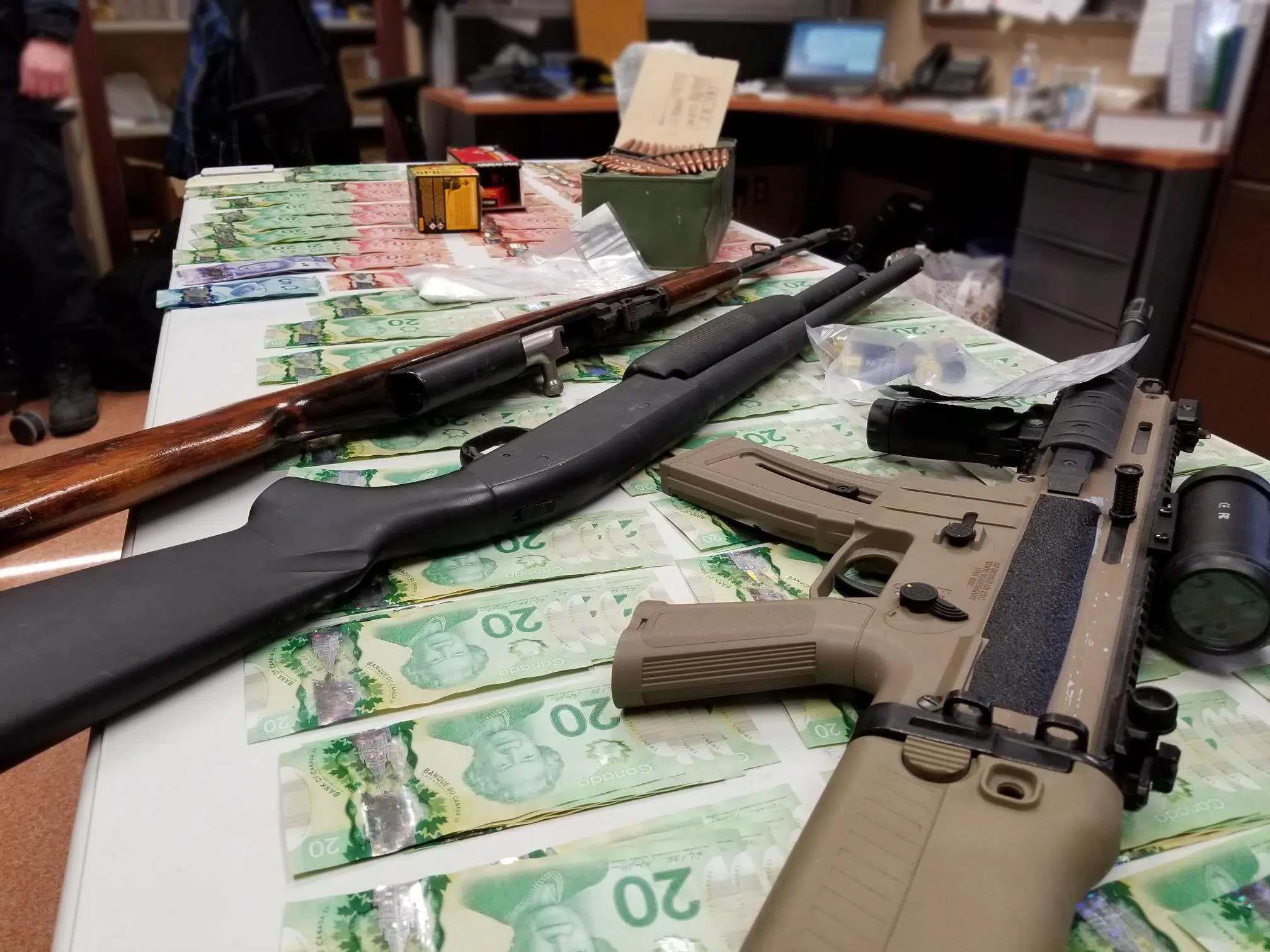 Guns, drugs and cash seized in joint law enforcement investigation ...
