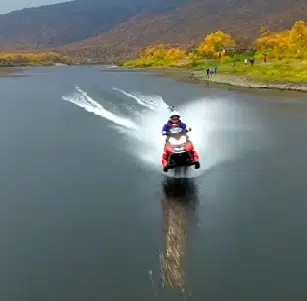 Watch Guy Set World Record Riding A Snowmobile Across A Lake. Yes. A ...
