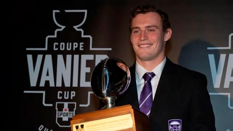 Western Mustangs quarterback Chris Merchant captures Hec Crighton ...
