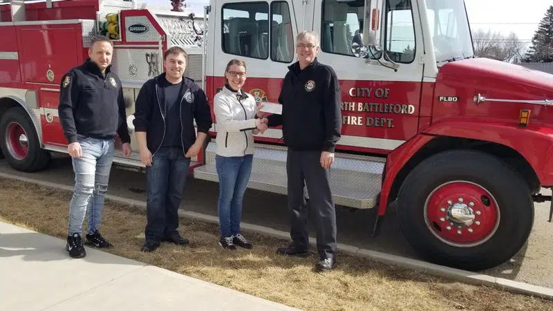 Fire department group shows support with sandbag fundraiser ...