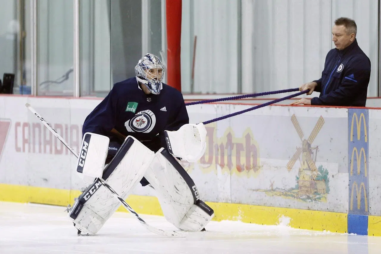 Jets goalie Connor Hellebuyck feeling right at home after signing ...