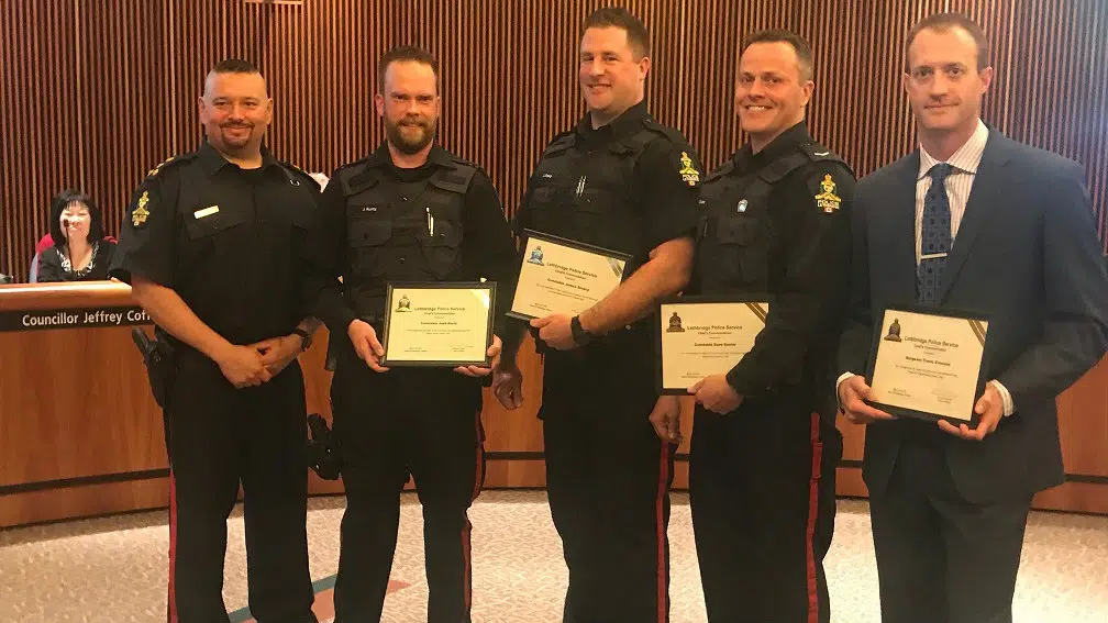 Four local police officers recognized for saving resident’s life in ...