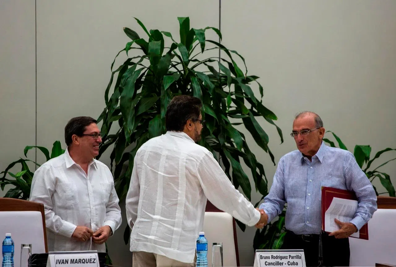 Colombia’s government, rebels sign modified peace agreement ...