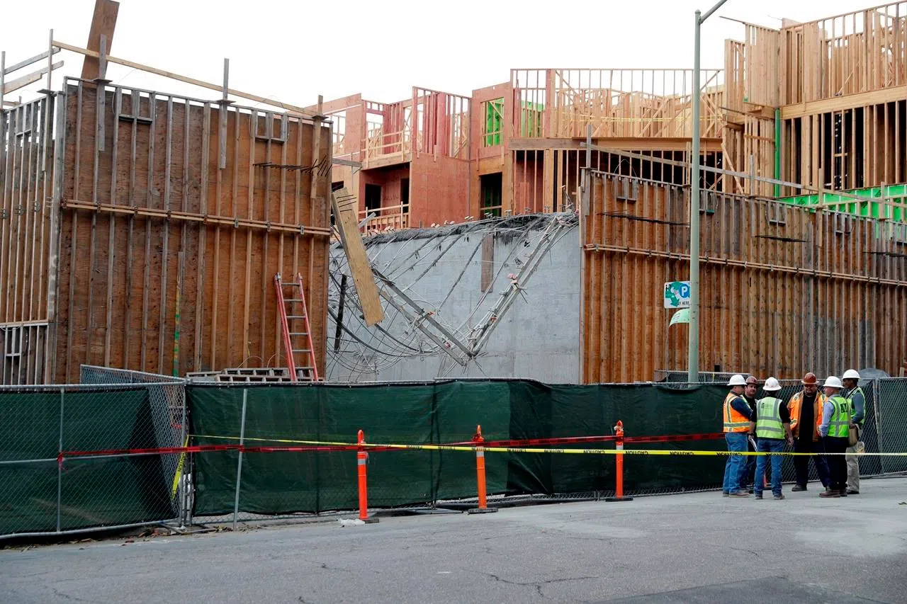 Workers dangle from cables after partial building collapse | CHAT News ...
