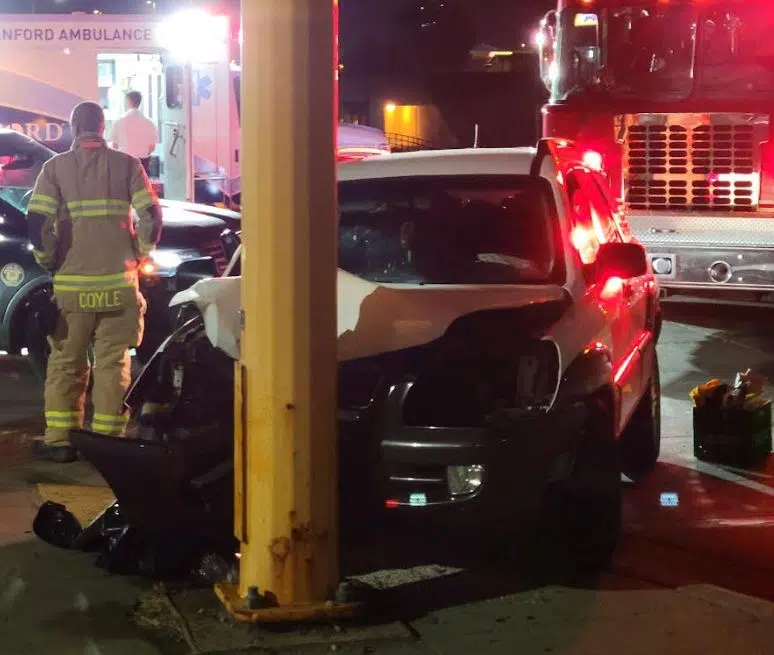 Man crashes SUV into traffic signal pole in front of Fargo police ...