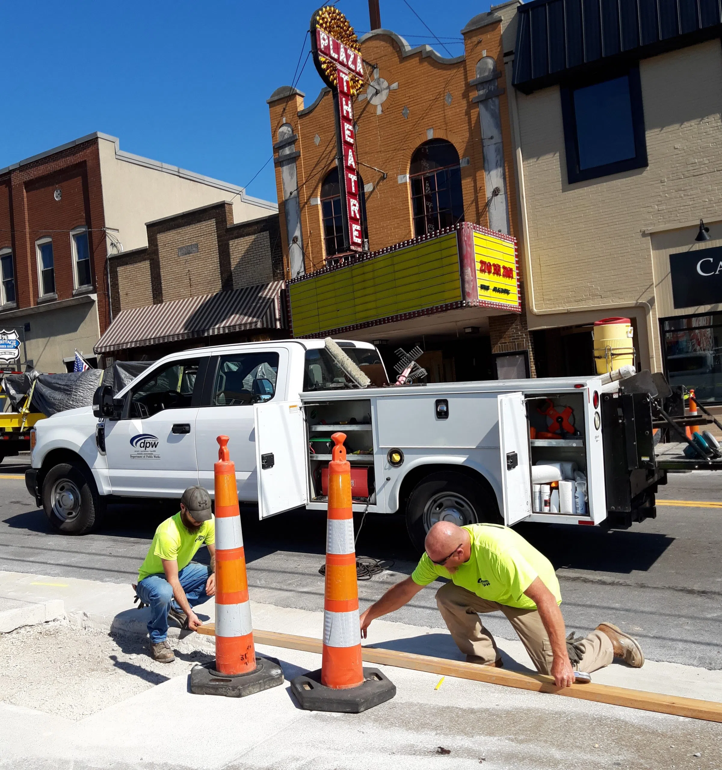 Midblock sidewalk ramps, crosswalk being installed near Plaza entrance ...